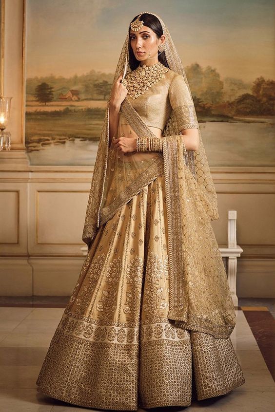 28 Eye Catching Golden Bridal Lehenga Designs Ideas for this Wedding